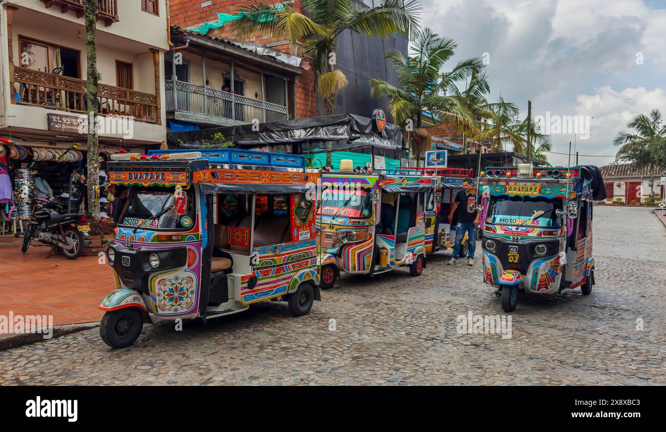 Three wheeled tempu's are used as taxis in the quaint town of Guatape ...