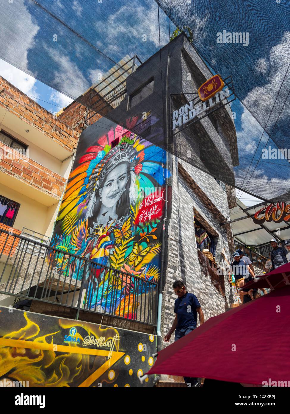 The murals in Comuna 13, a barrio in Medellin that was once quite ...