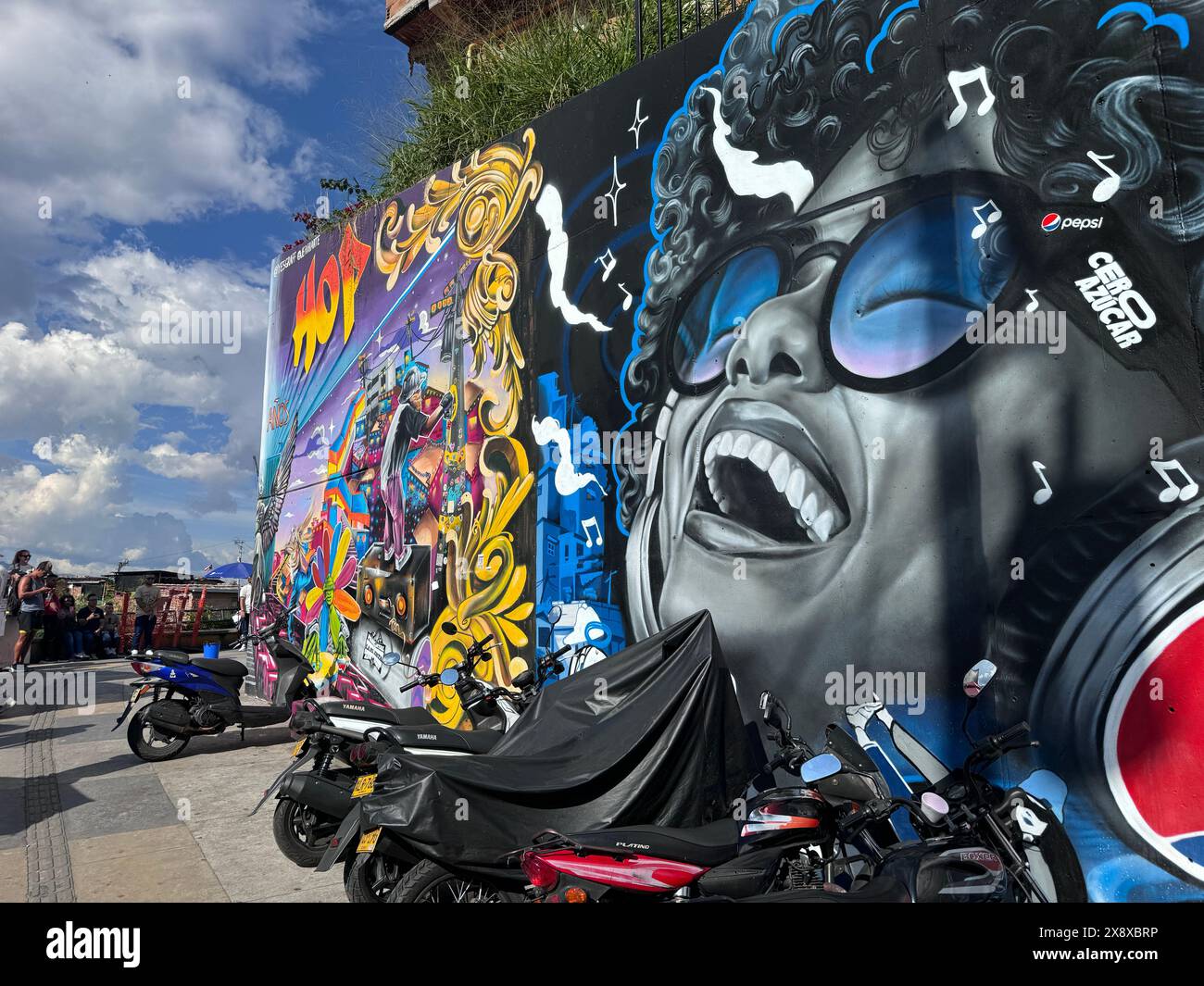 The murals in Comuna 13, a barrio in Medellin that was once quite ...