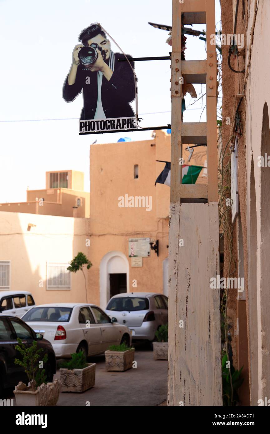 The sign of a photo studio outside of the historic Ksar El Atteuf. El ...