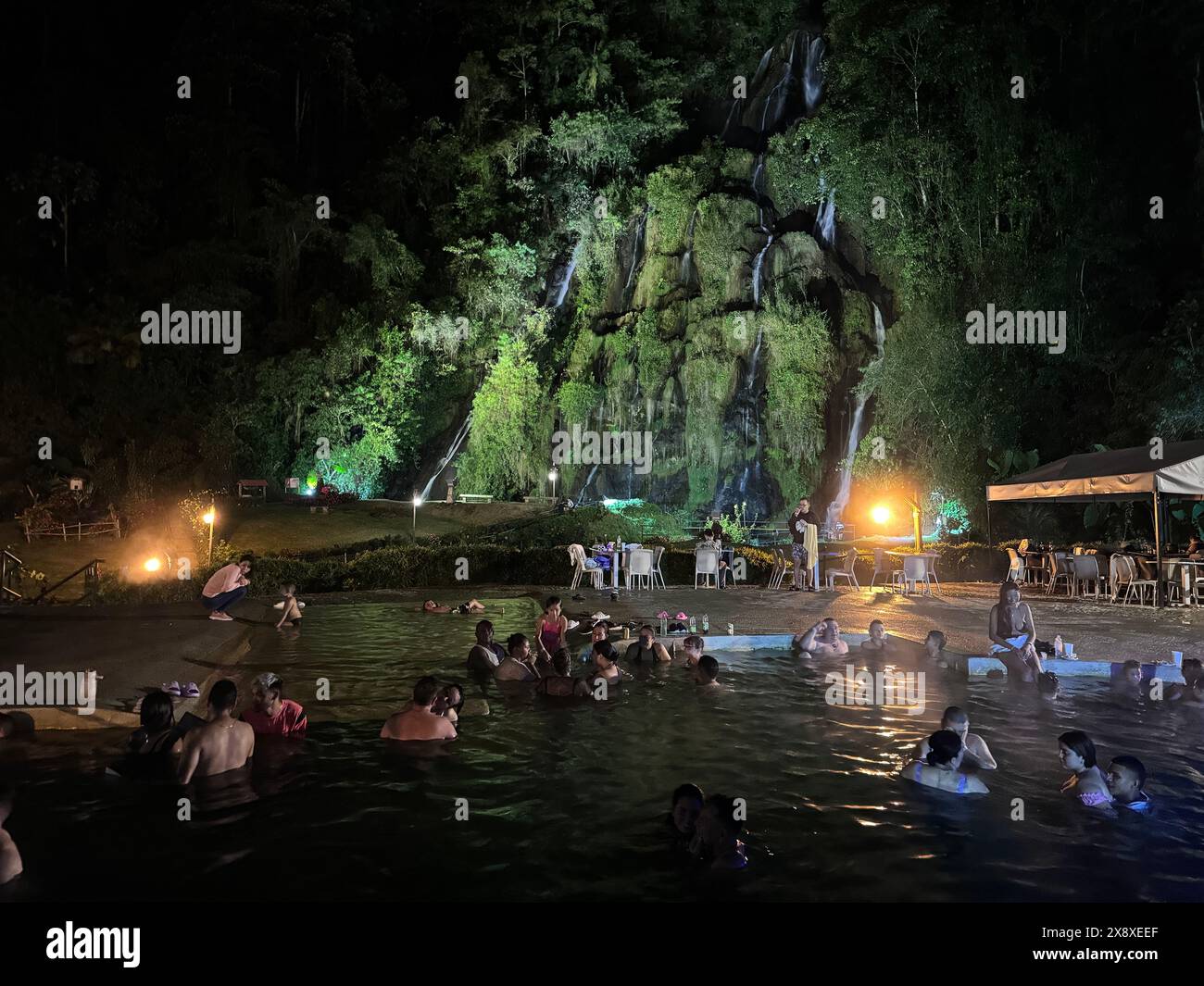 A beautiful waterfall sits above the Santa Rosa de Cabal hot springs ...