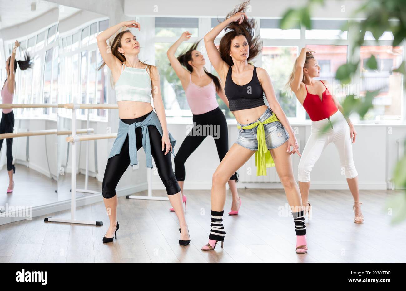 Group of women dancing high heels in studio Stock Photo - Alamy