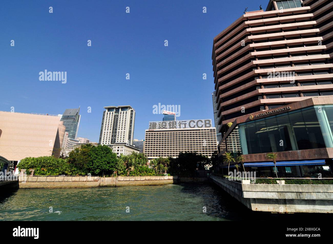 The Intercontinental hotel by theVictoria harbour promenade in Tsim Sha Tsui, Kowloon, Hong Kong ...