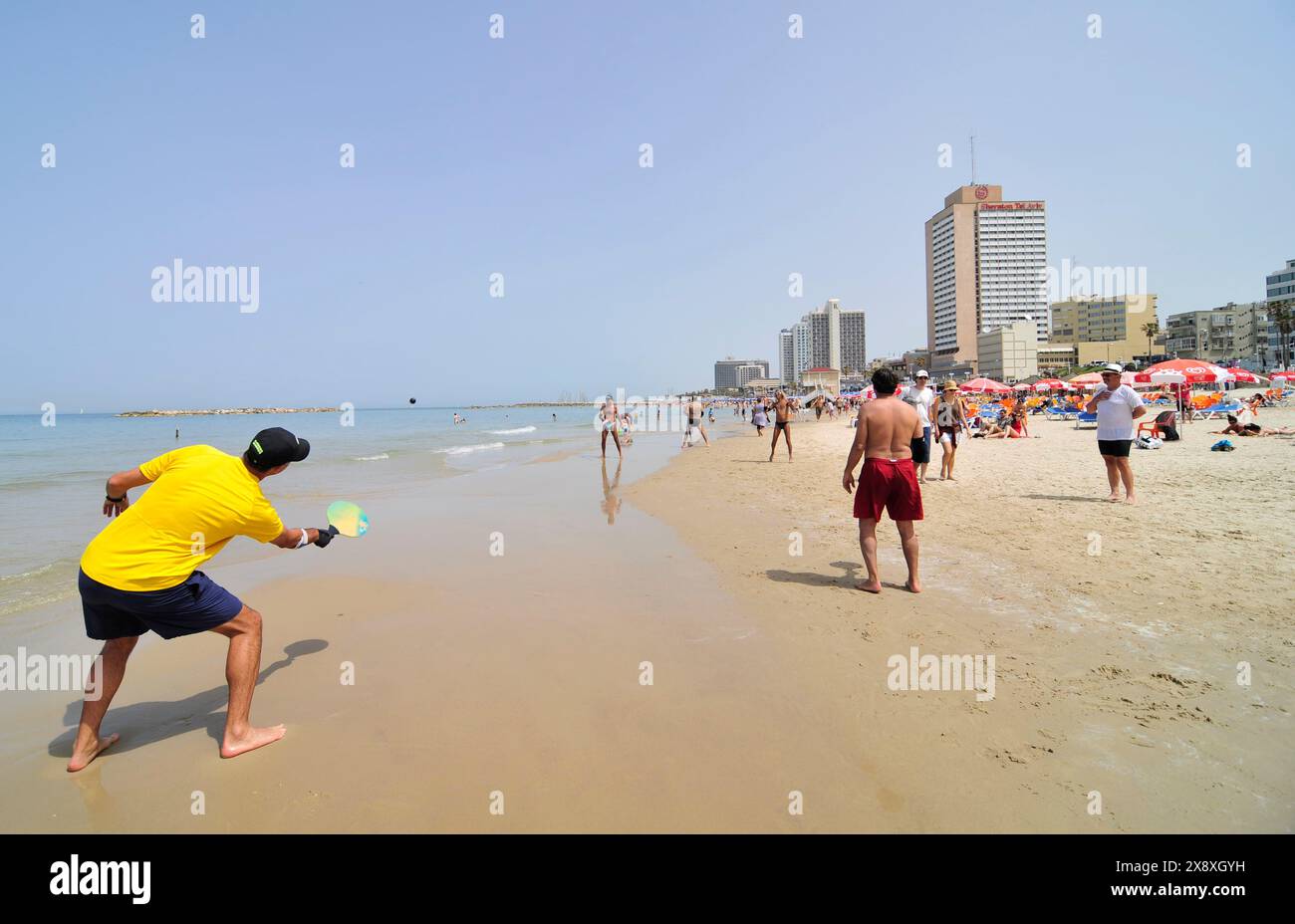 Israeli men playing Matkot on the beach in Tel-Aviv, Israel Stock Photo ...