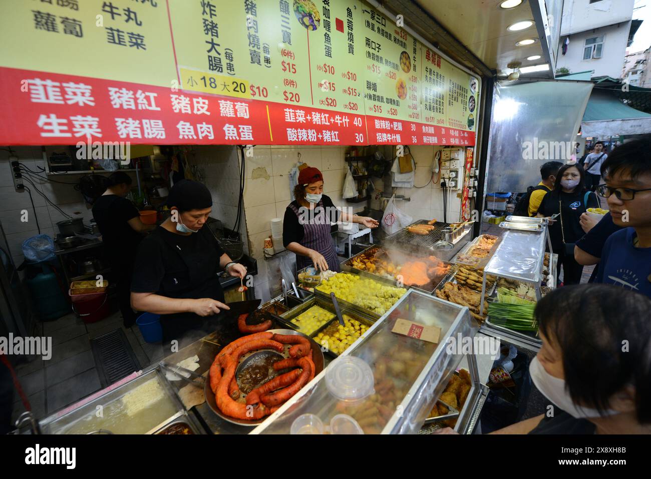 A busy Cantonese food takeaway shop in Sham Shui Po, Kowloon, Hong Kong ...
