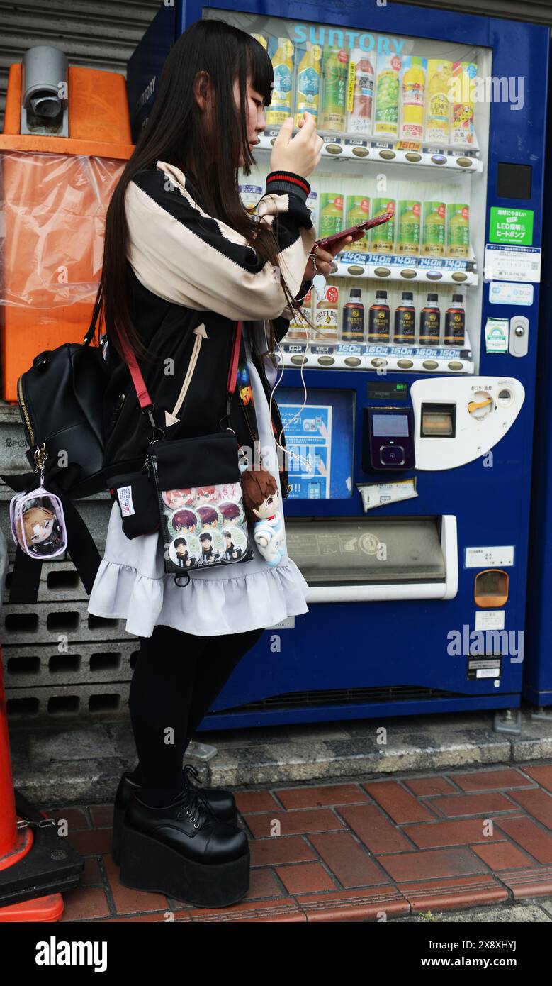A young Japanese woman dressed with anime accessories. Ikebukuro, Tokyo ...