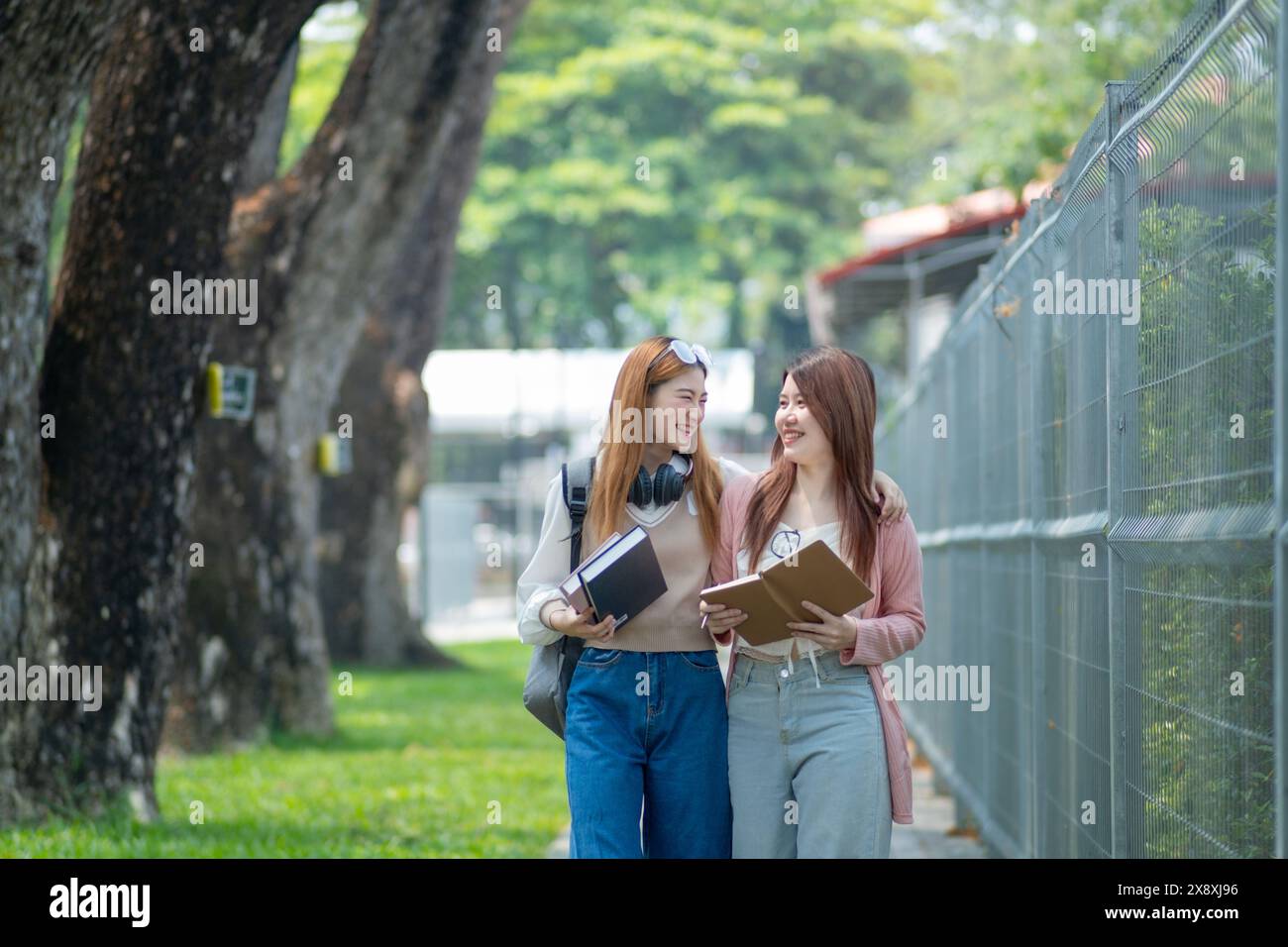 College students walking together outdoors, Group of happy friend ...