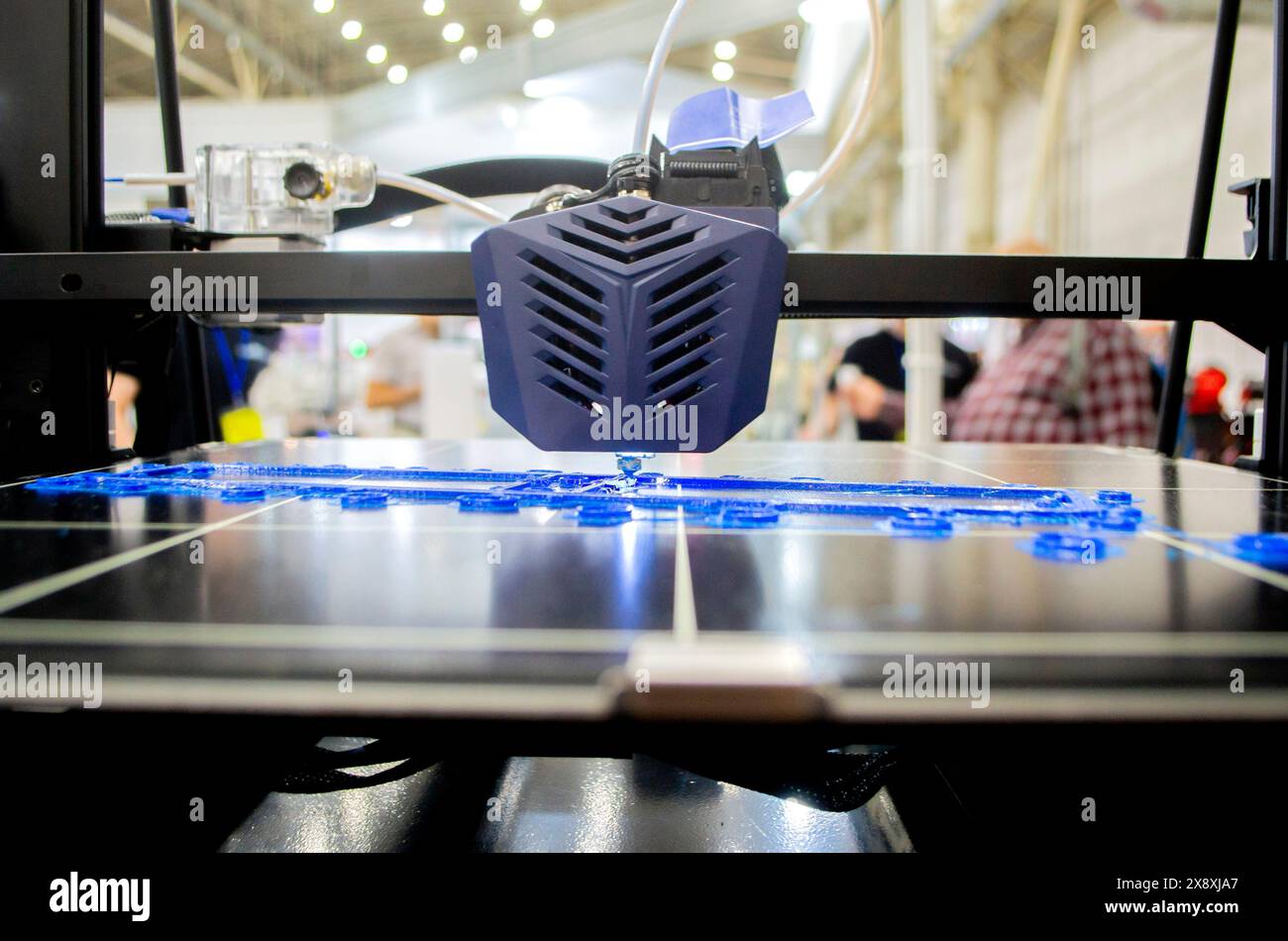 3D printer working close-up. 3D printer prints model from molten ...