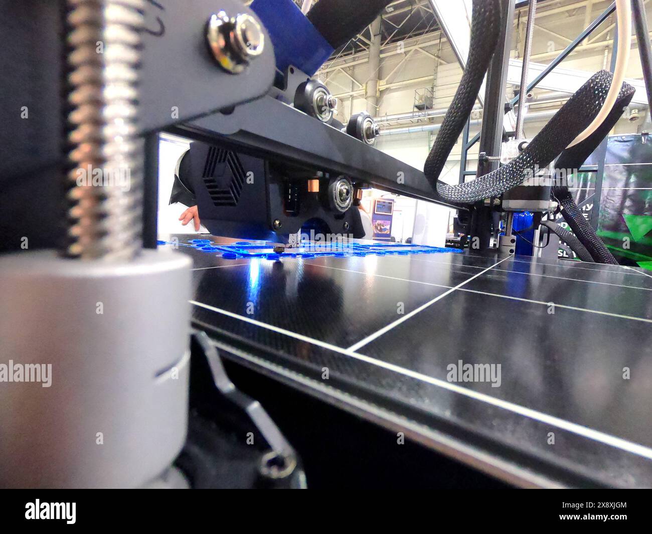 3D printer working close-up. 3D printer prints model from molten ...