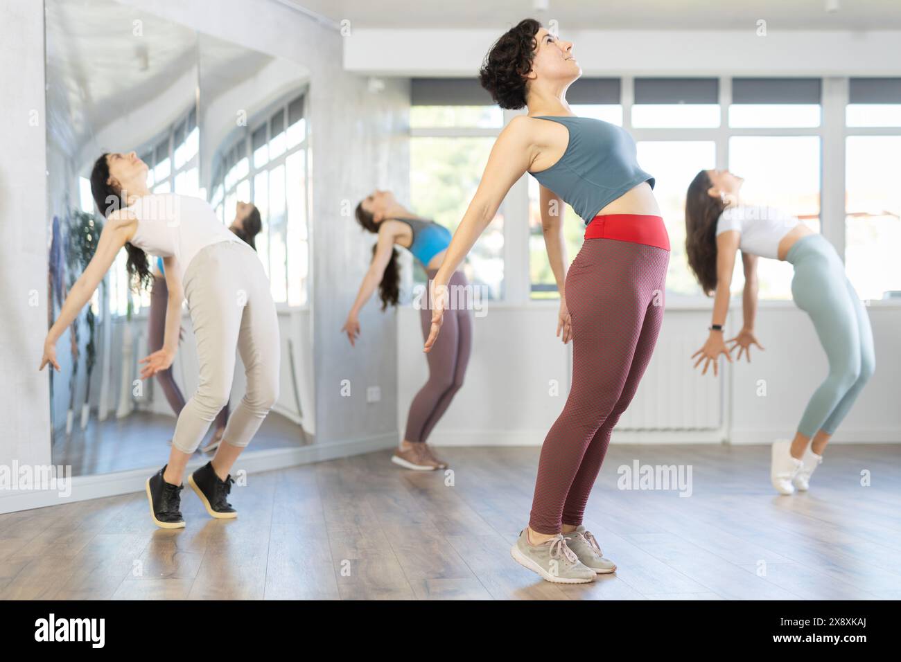 Female teacher conducts modern dance lessons for group of girls Stock ...