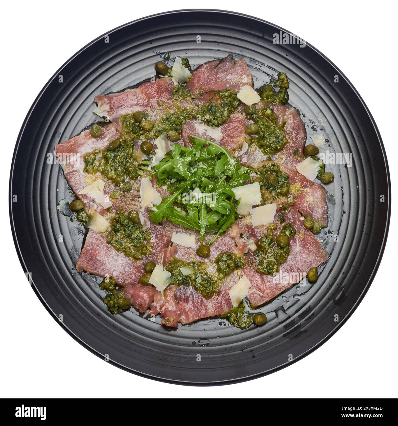 tuna carpaccio - slices of fresh raw tuna fillet on black ceramic plate ...