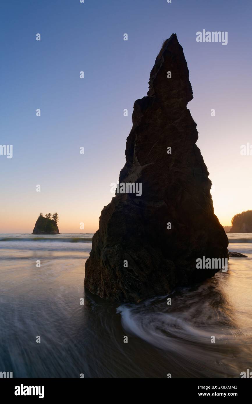 Waves wrapping around base of sea stack, Scotts Bluff, South Coast ...