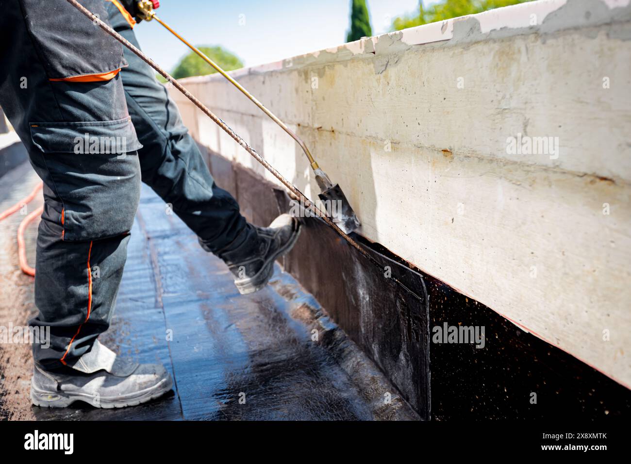Worker is unroll rolled up, sheet of waterproofing installation ...