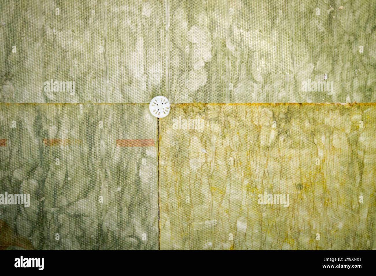 Indoor wall with thermal insulation, layer of mineral, rock or stone ...