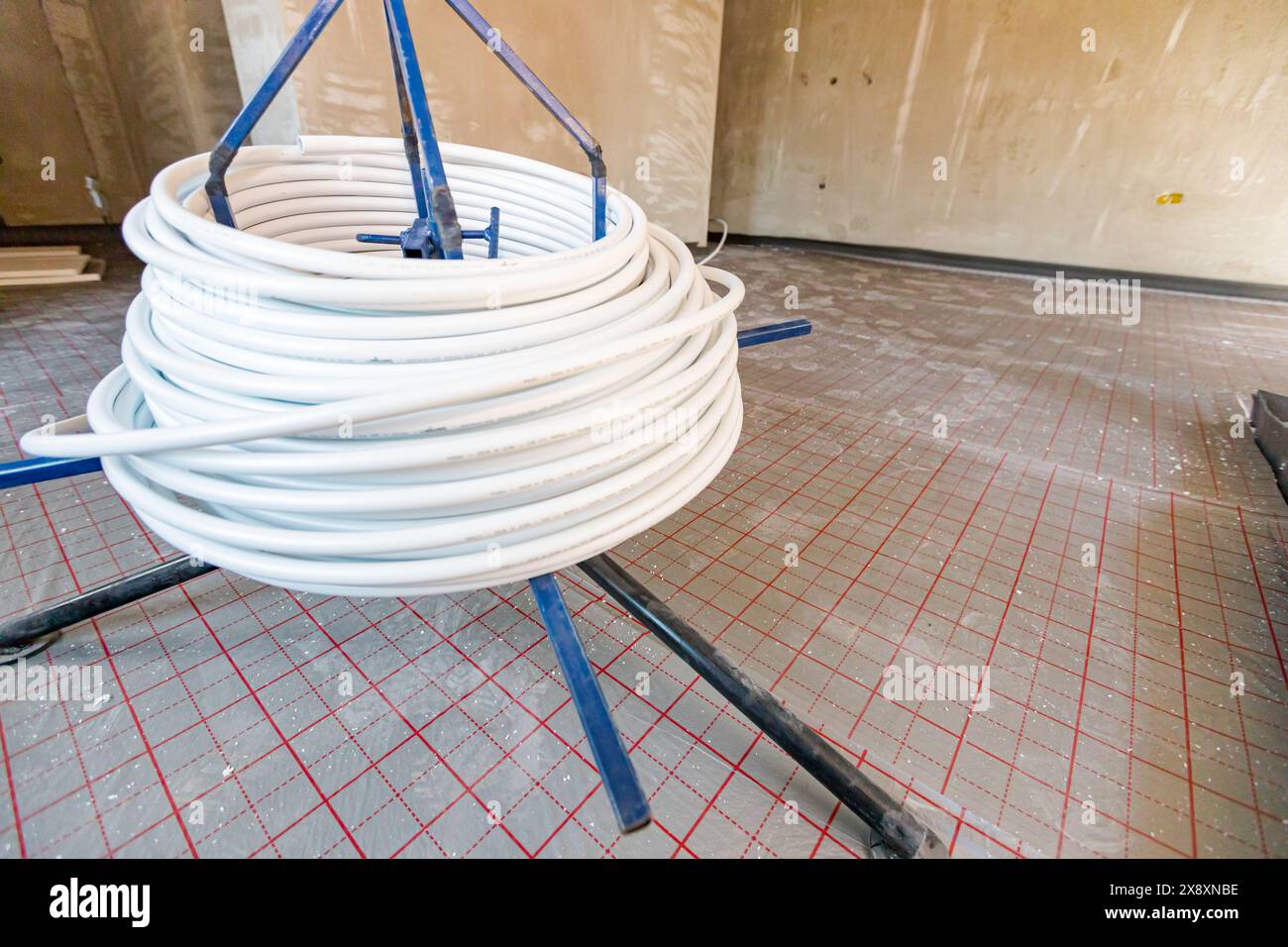 Tool for unwinding coil of thin white tubes for central heating floor ...