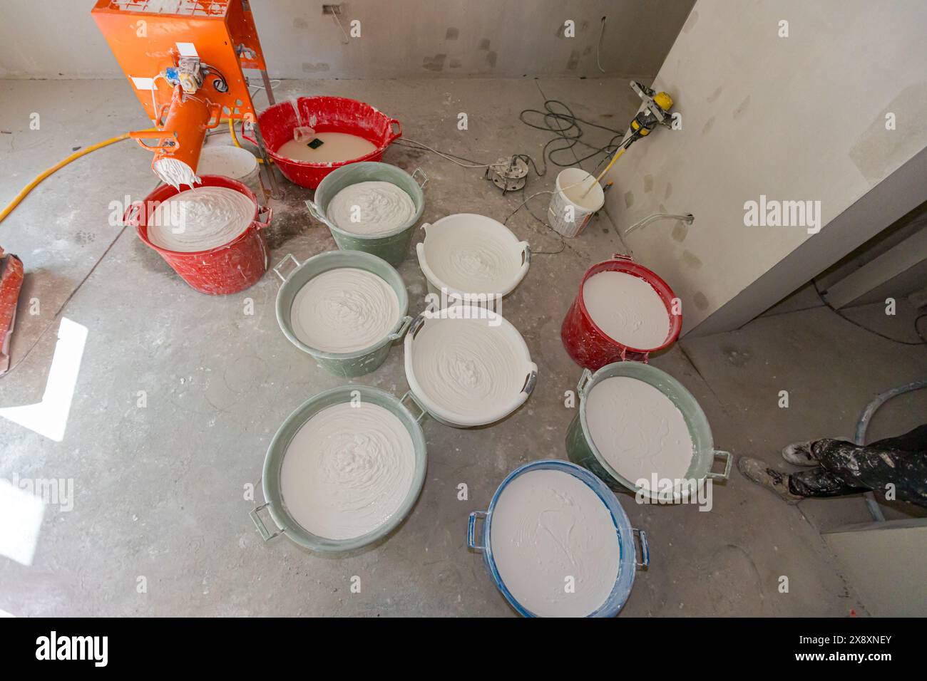 Electric mixer for mixes dry white putty, stir plaster and water in a ...