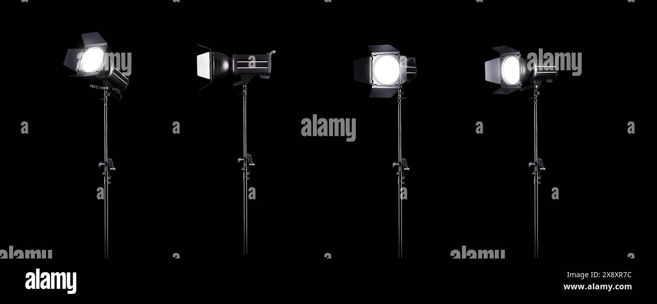 Photography studio flash on a lighting stand isolated on black ...