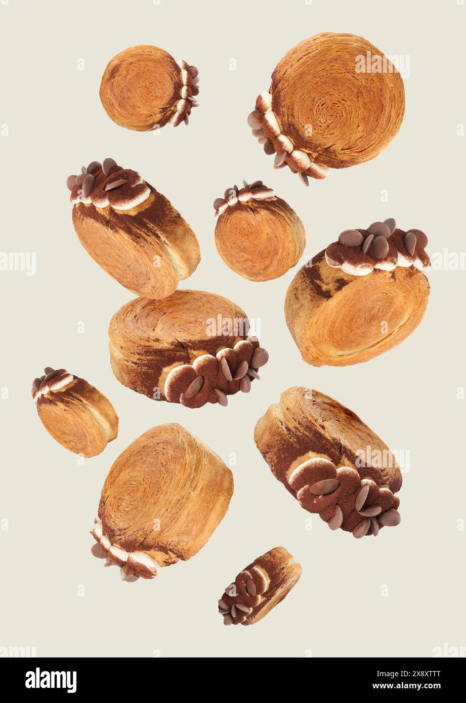 Delicious round croissants in air on light background. Puff pastry ...