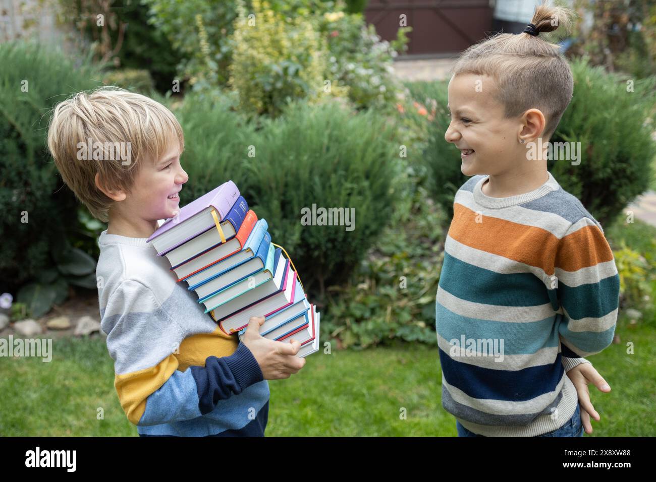 Two boys, classmates, friends are standing opposite each other, one ...