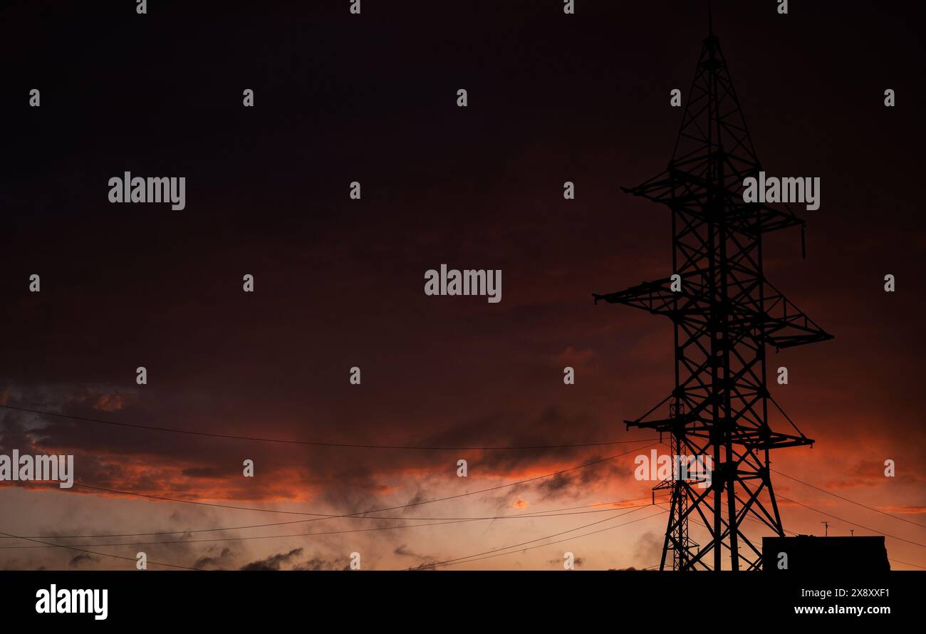 High-voltage electric power lines at sunset Stock Photo - Alamy