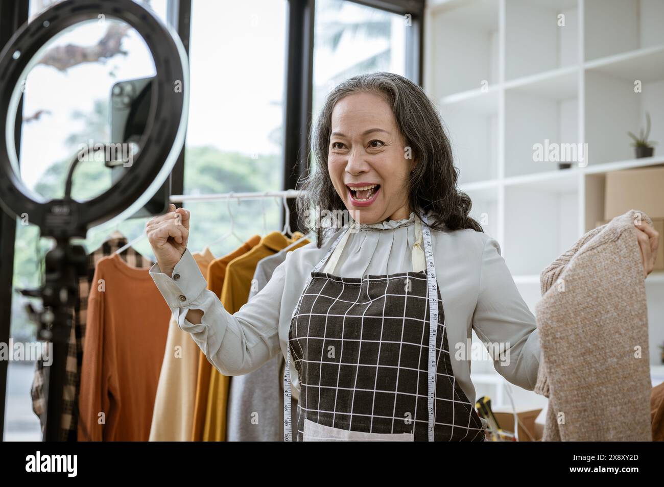 Excited woman streaming live fashion hi-res stock photography and ...
