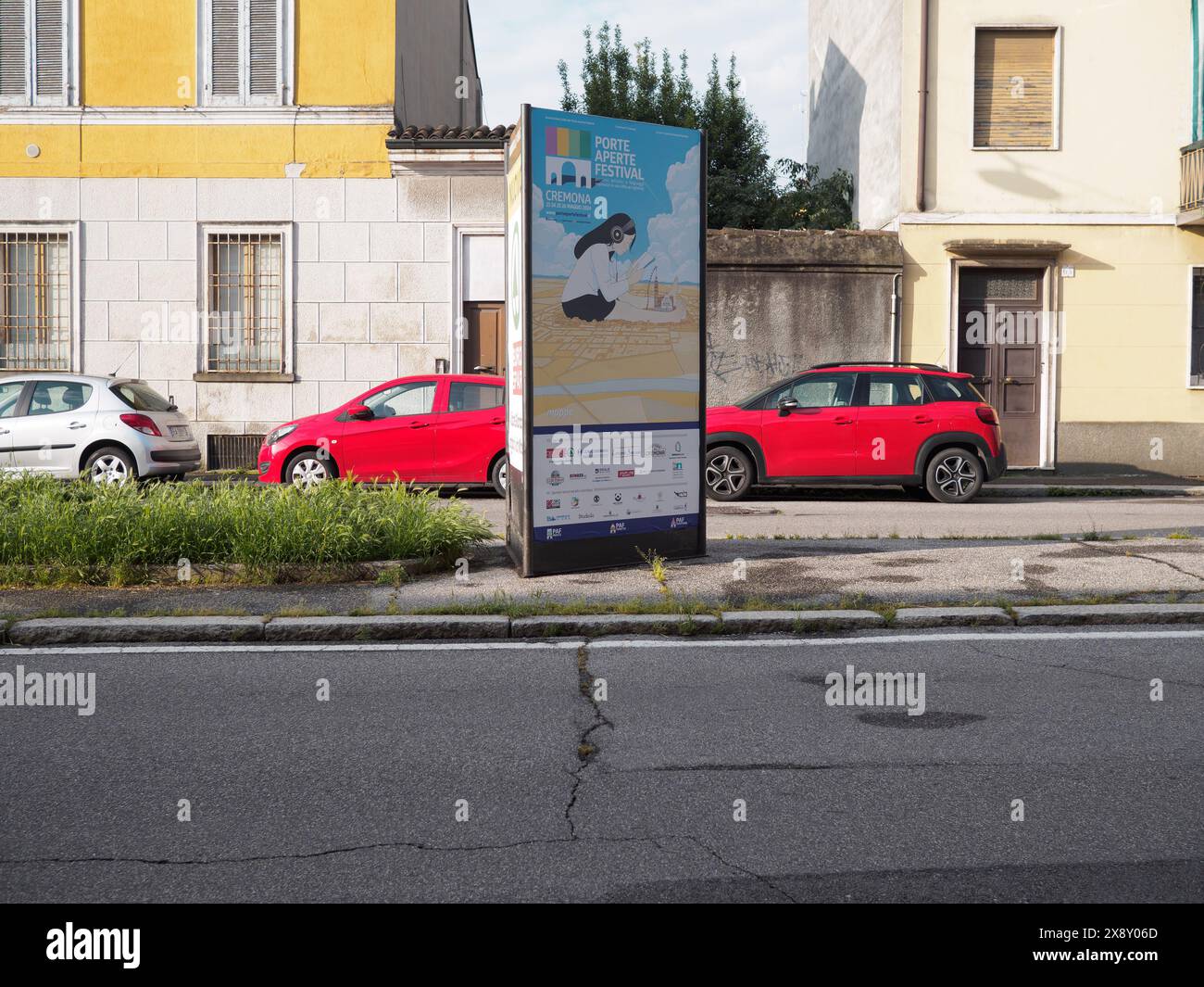 Cremona, Italy - May 15th 2024 Street view showcasing a billboard ...