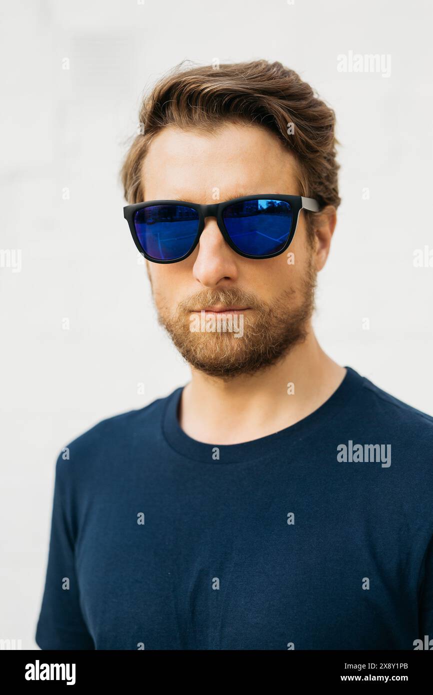 Standing white wall reflective pose hi-res stock photography and images ...