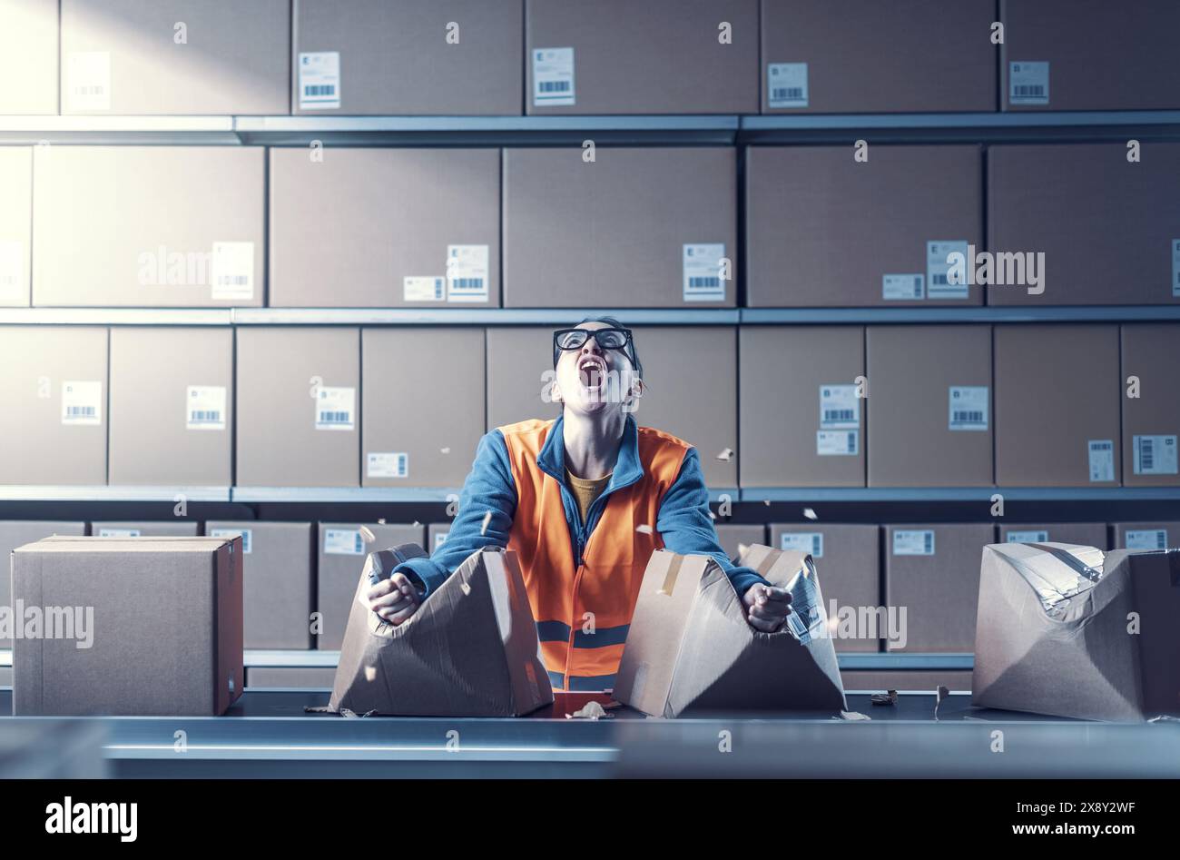 Angry Rebellious Worker Punching And Smashing Boxes On The Conveyor