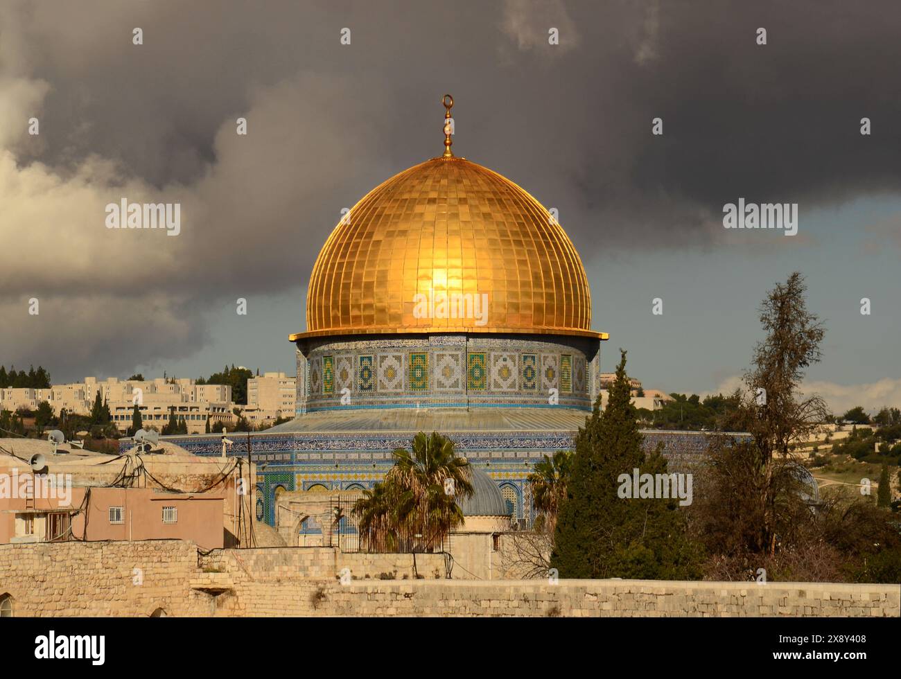 Golden Dome of the Al Aqsa mosque with storm clouds in background ...