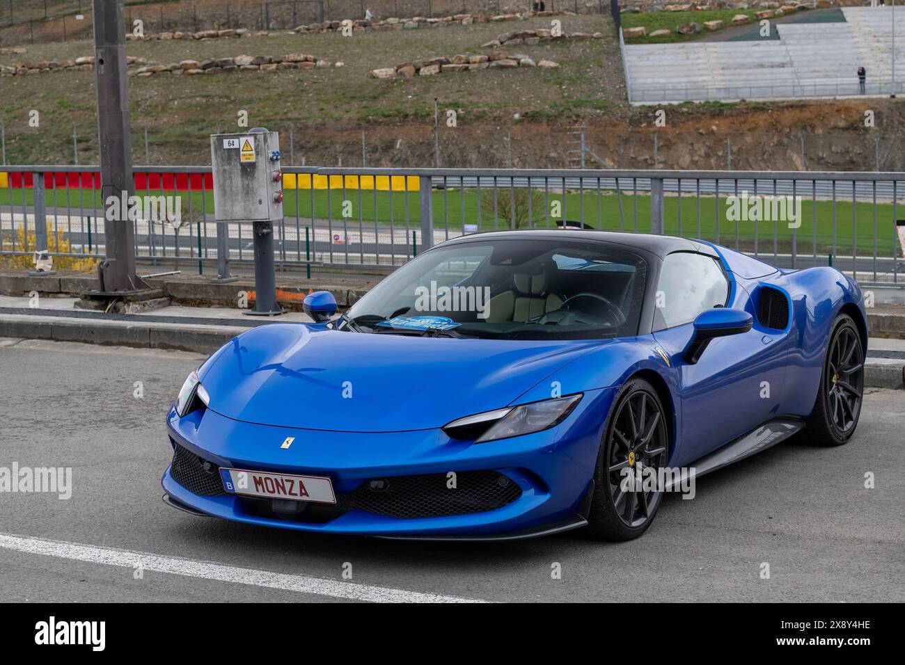 Spa-Francorchamps, Belgium - View on a blue Ferrari 296 GTS parked on a ...