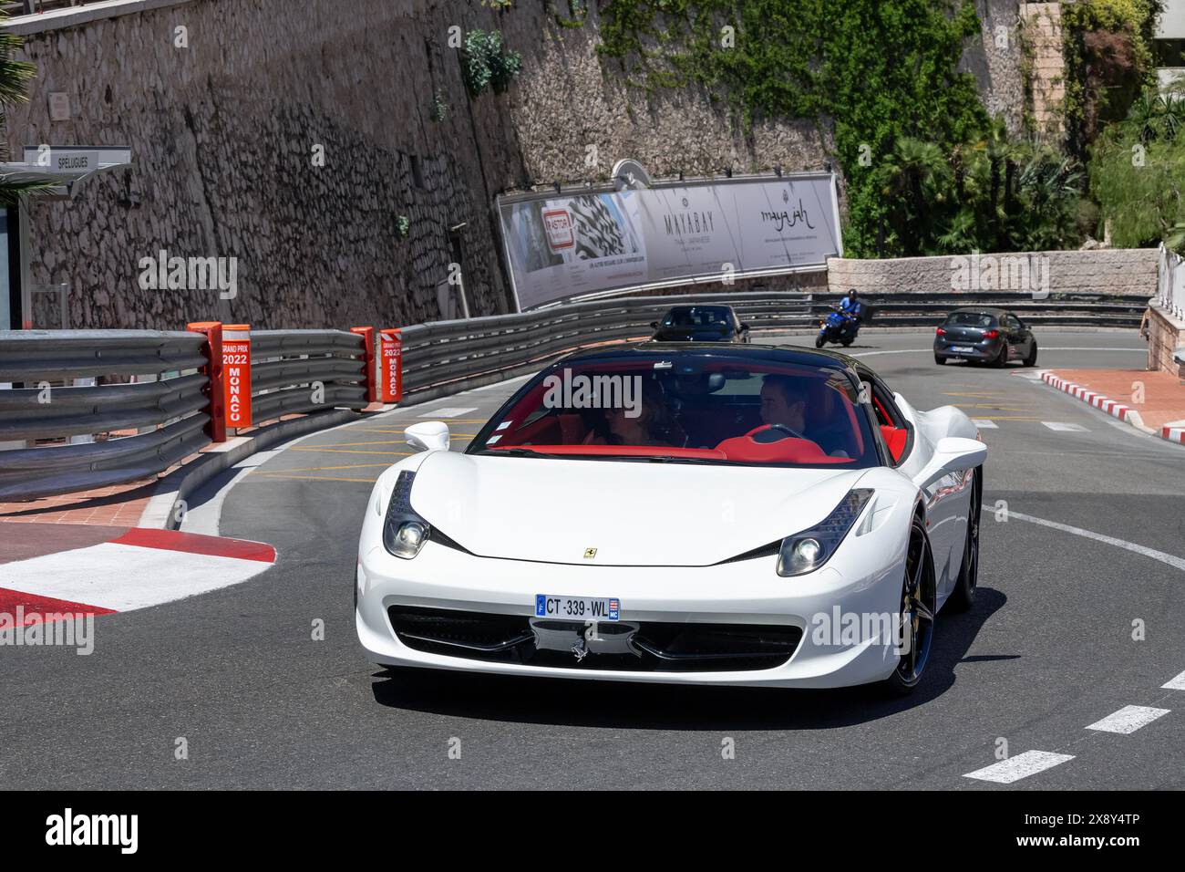 Monte Carlo, Monaco - View on a white Ferrari 458 Italia driving on the ...