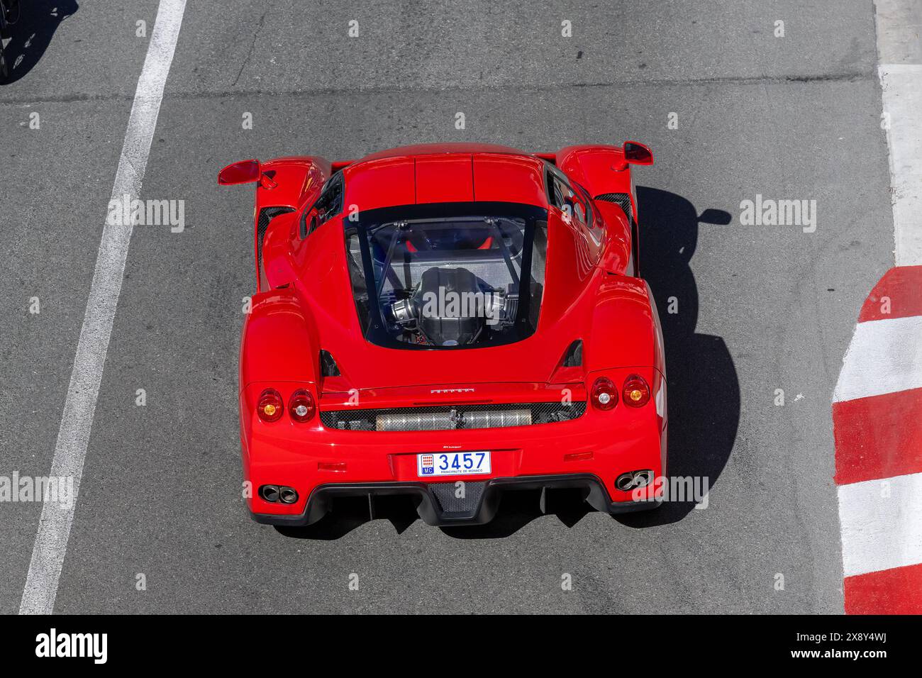Monte Carlo, Monaco - View on a red Ferrari Enzo driving on the road in ...