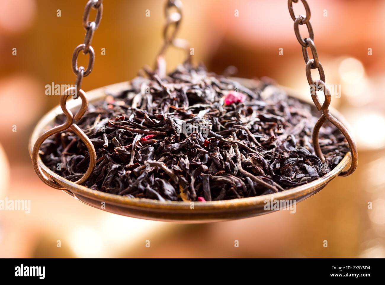 black tea in vintage iron balance scale Stock Photo - Alamy