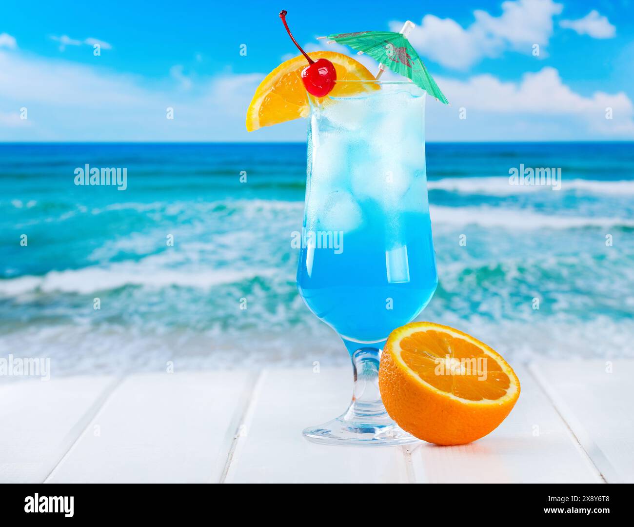 Blue Curacao cocktail on a beach Stock Photo - Alamy