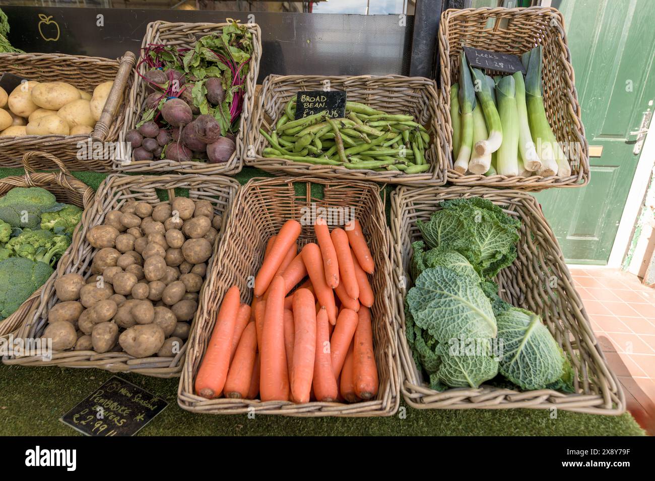 Wicker baskets full of fresh vegetables on display in John's Street ...