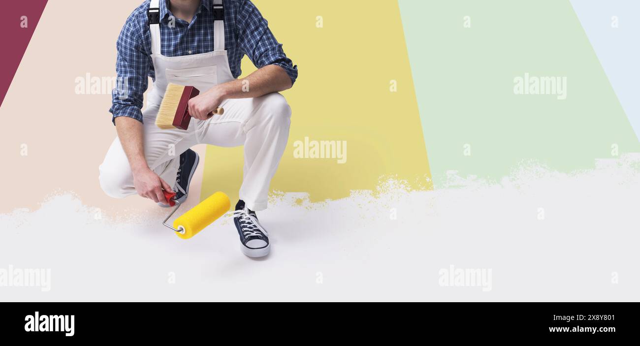 Professional painter and colored paint stripes, painting and decoration ...