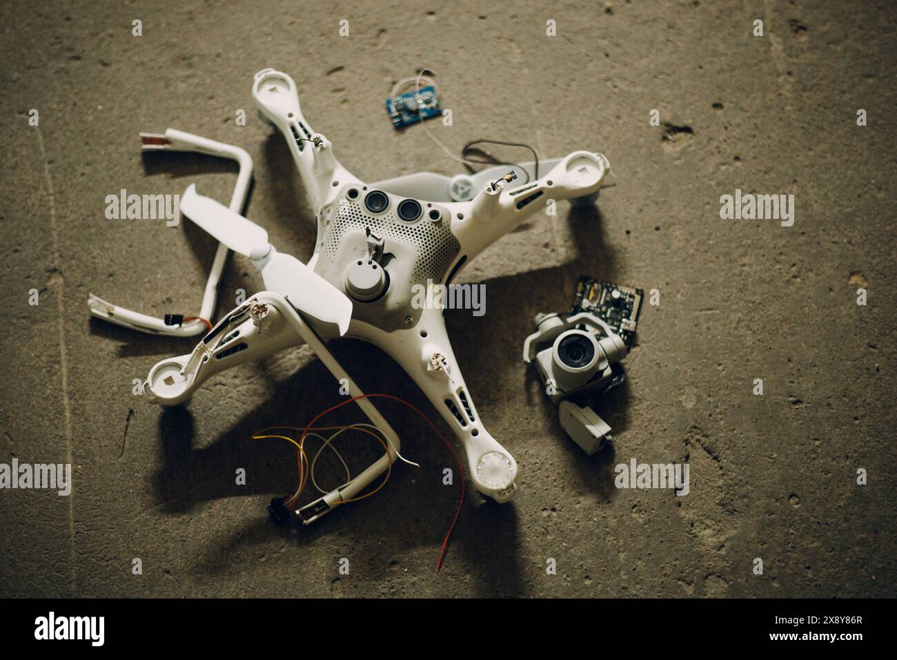 Fallen damaged quadrocopter drone crash on a floor Stock Photo - Alamy