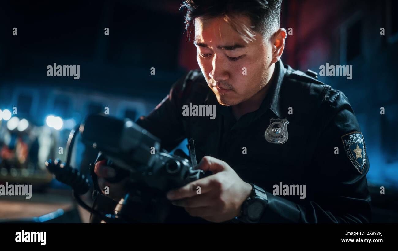 Asian Policeman Taking Photos of Evidence on a Crime Scene at Night ...