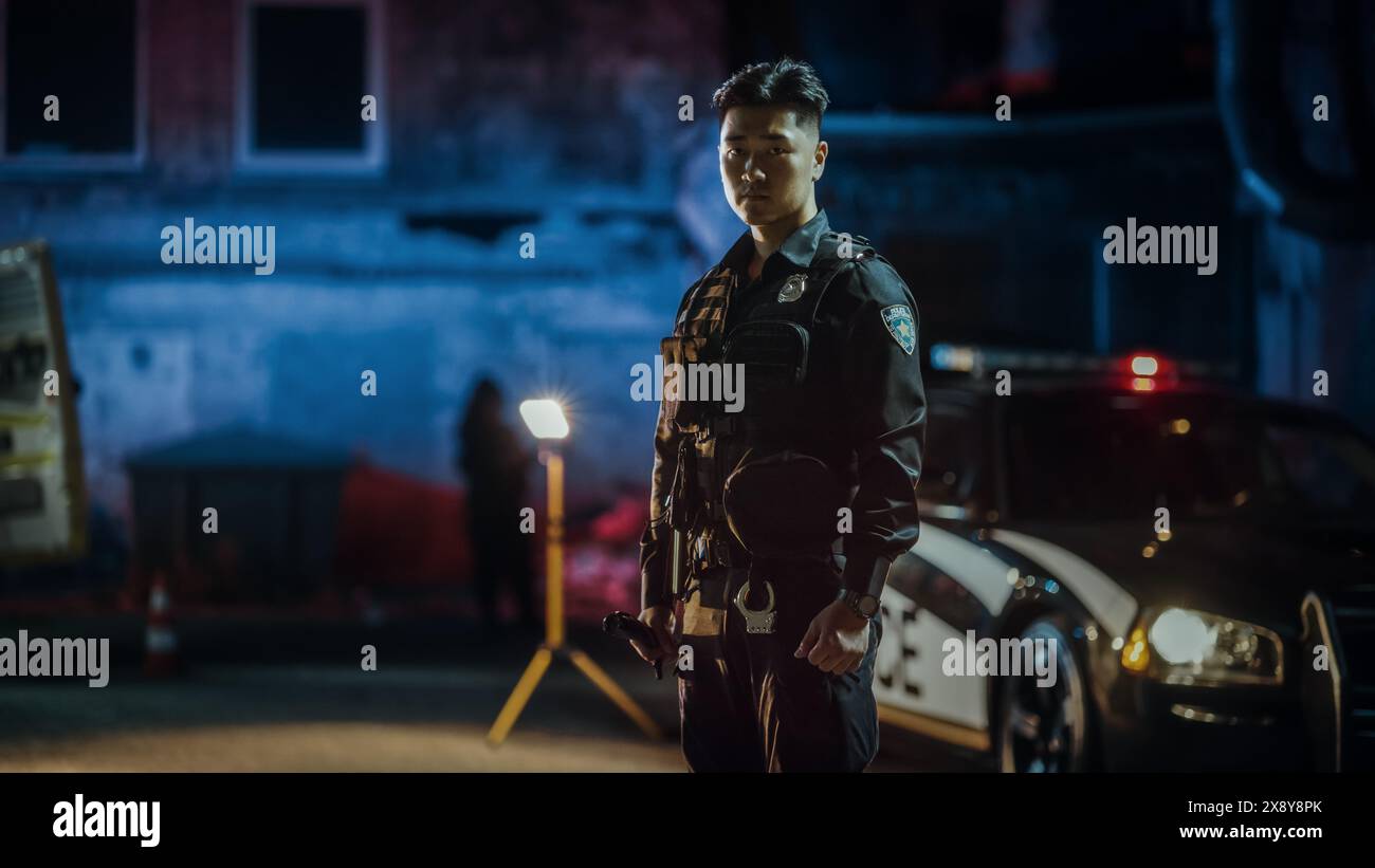 Wide Portrait Shot of a Young Asian Police Officer Holding a Flashlight ...