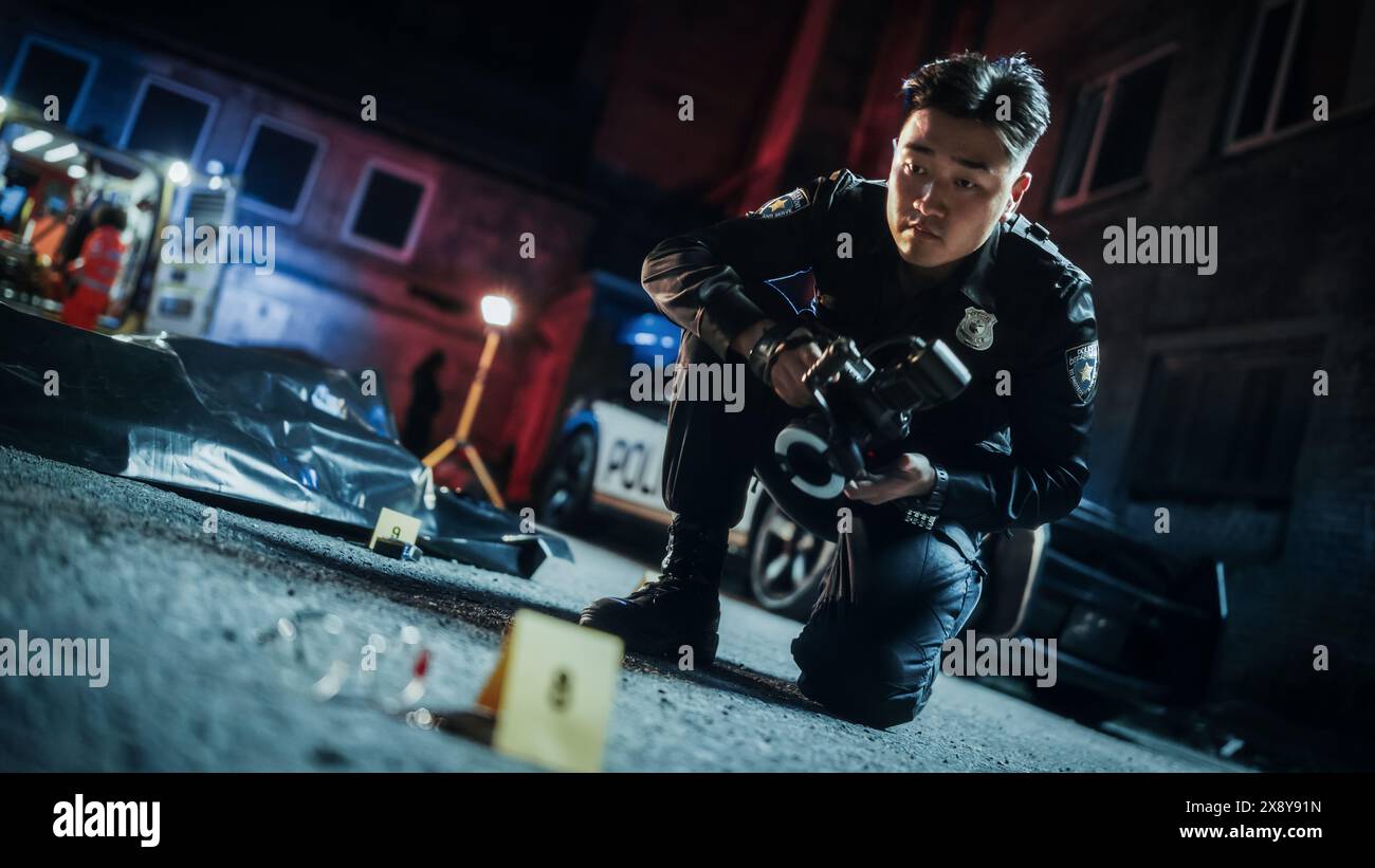 Portrait Tilted Shot of Male Asian Police Officer Taking Forensic ...