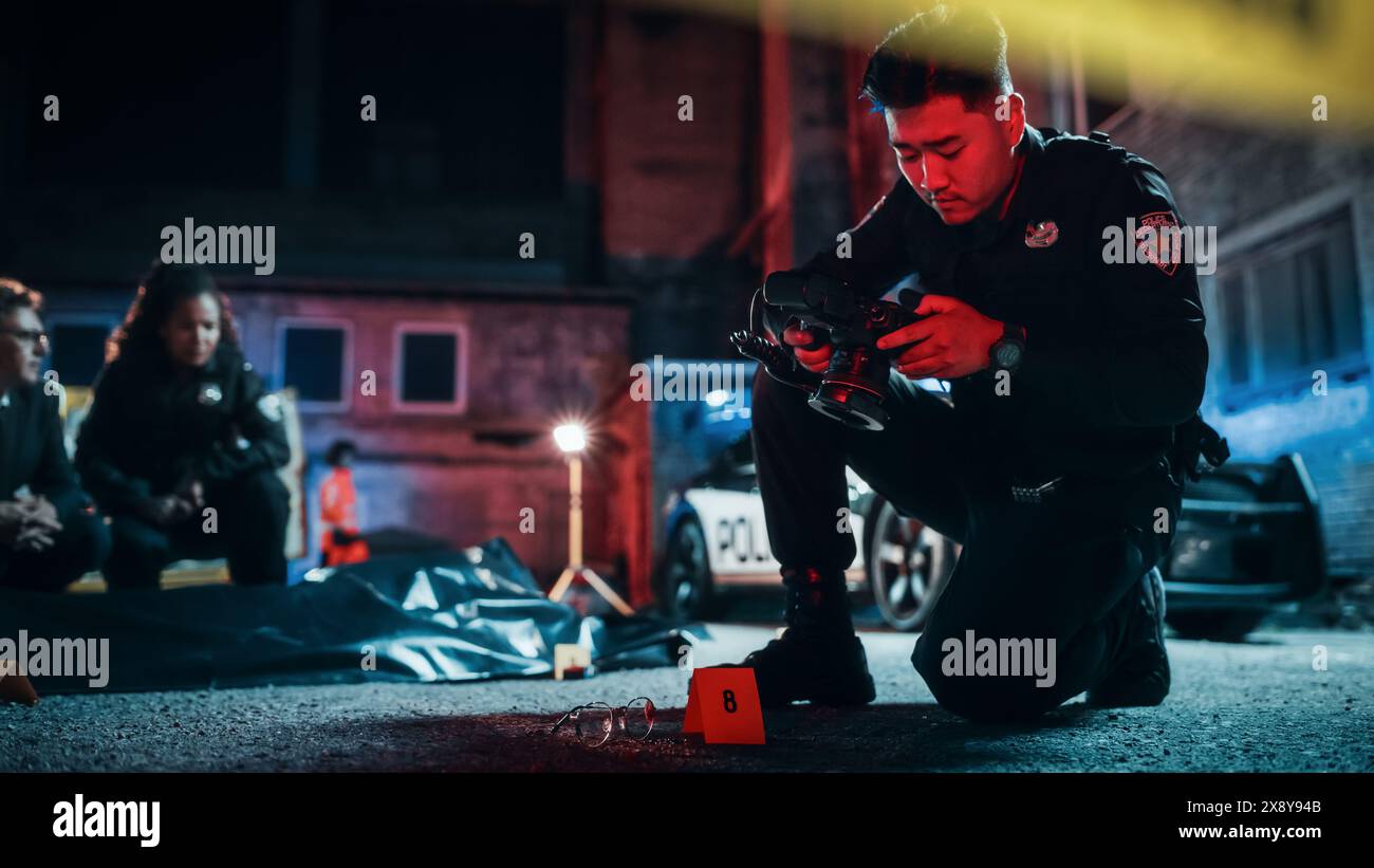 Policeman Taking Photos of Marked Evidence on a Crime Scene at Night ...