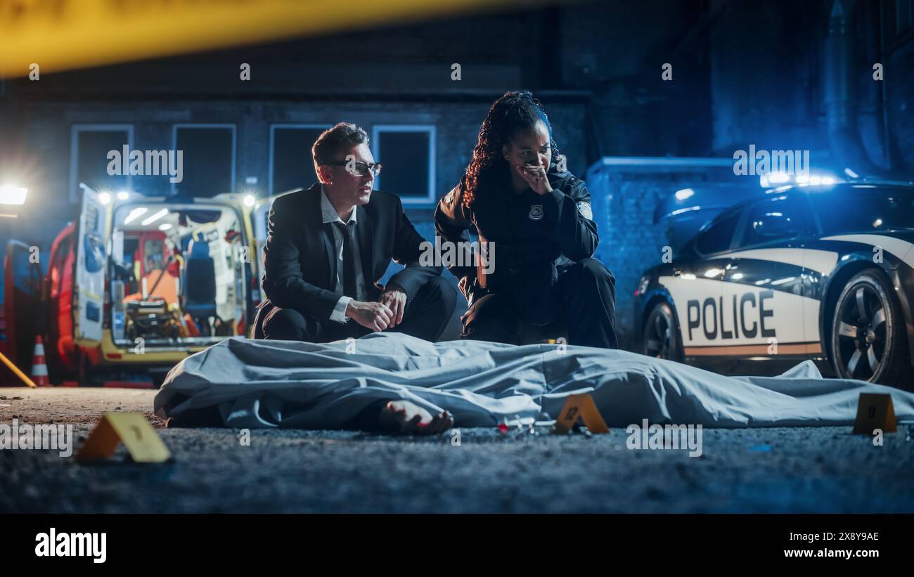 Portrait of Two Police Officers Working on a Case at Night by Visiting ...