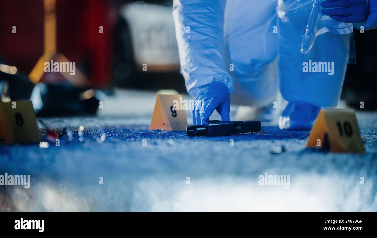 Forensics Working on Crime Scene at Night Gathering Evidence. Police ...