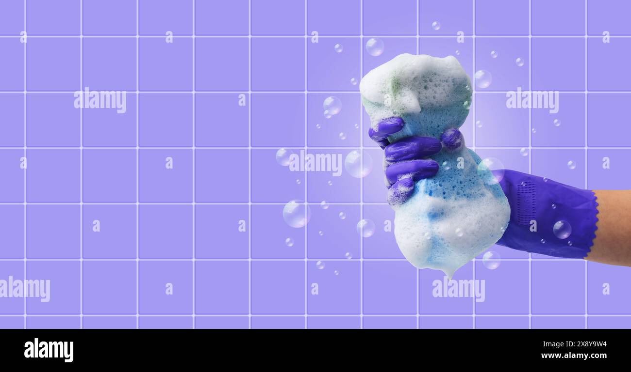 Female hand wearing a cleaning glove and holding a soapy sponge, banner ...