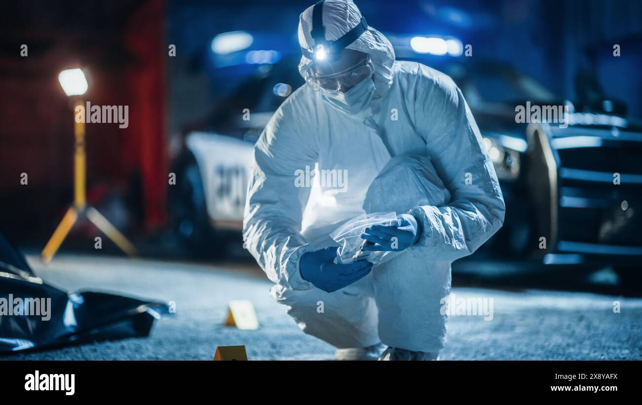 Portrait of Two Forensics Experts Doing Fieldwork at Night at a Crime Scene. One Technician ...