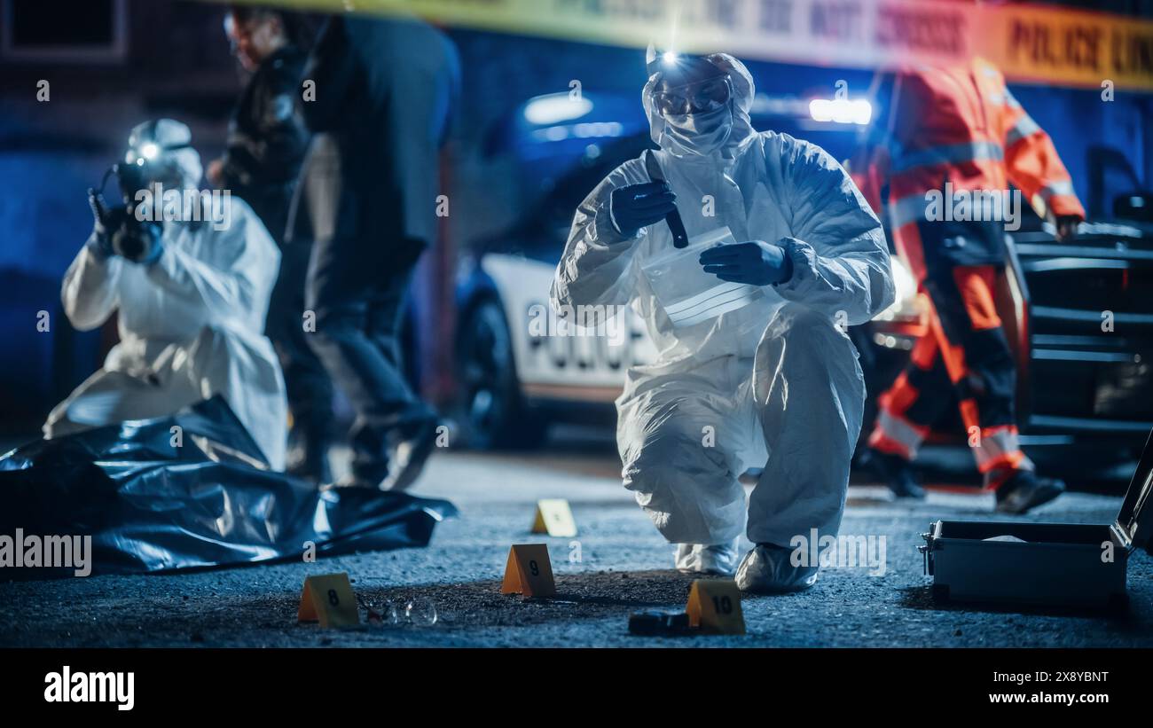 Police Department Team Working on a Crime Scene, Collecting Evidence ...