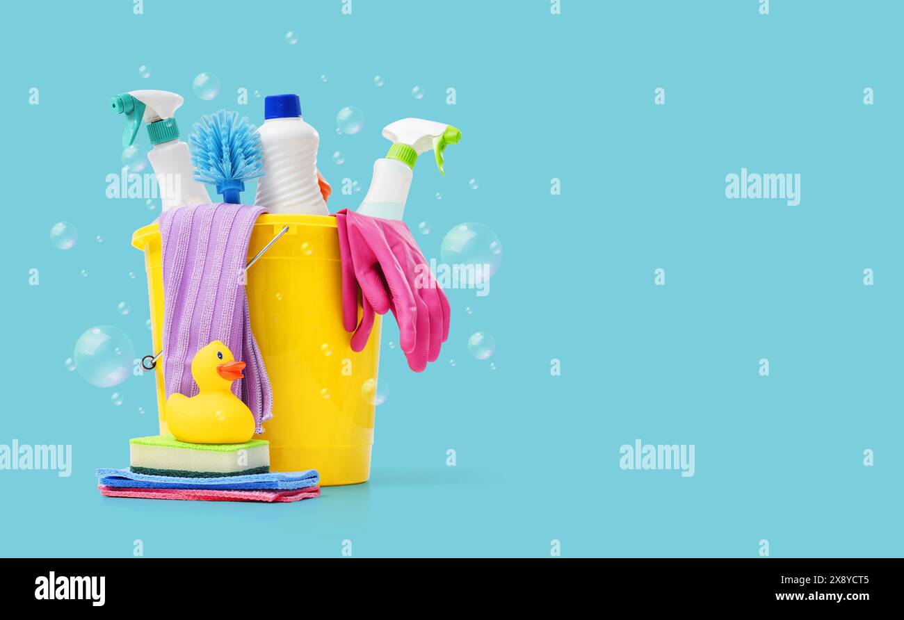 Housecleaning detergents and cleaning products surrounded by soap ...