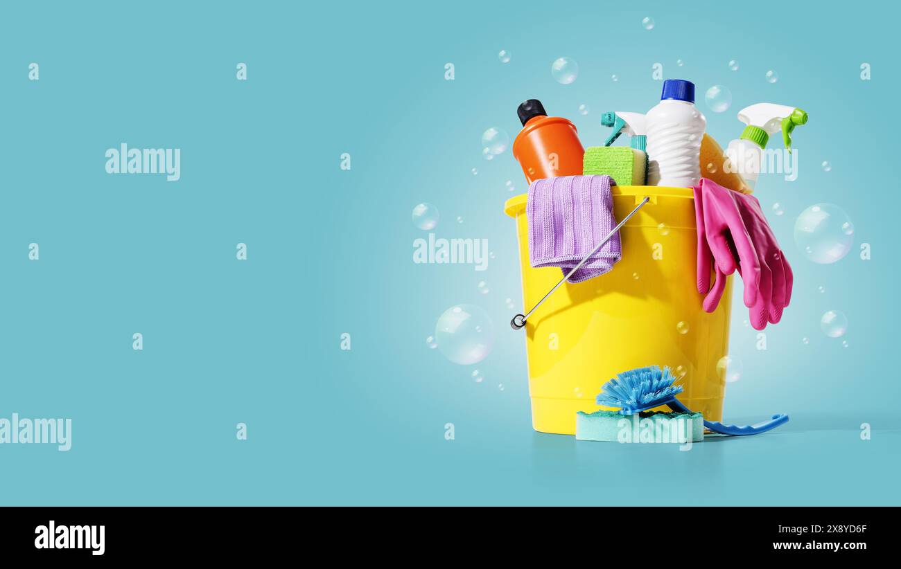 Housecleaning detergents and cleaning supplies surrounded by soap ...