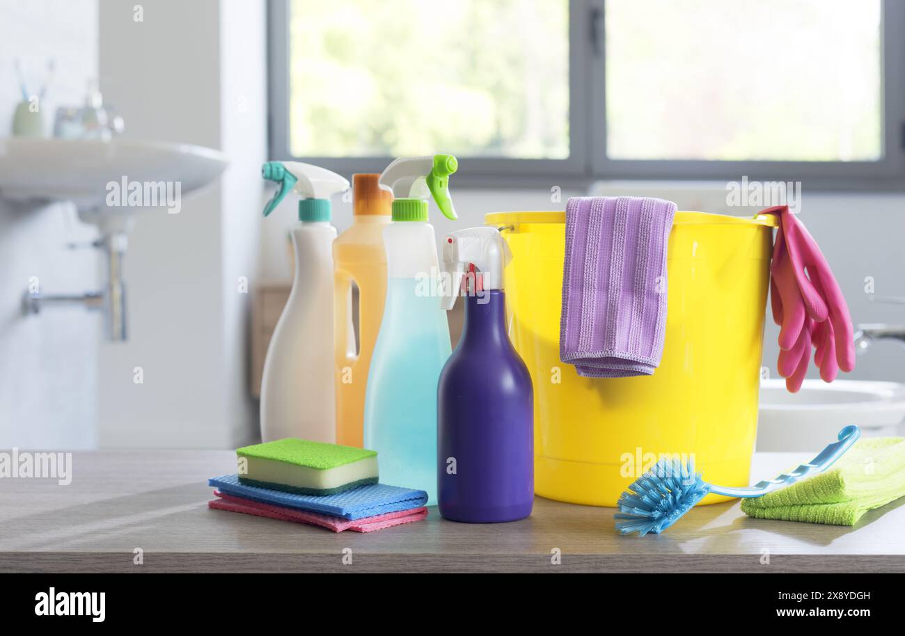 Assorted detergents and cleaning supplies in the bathroom at home ...