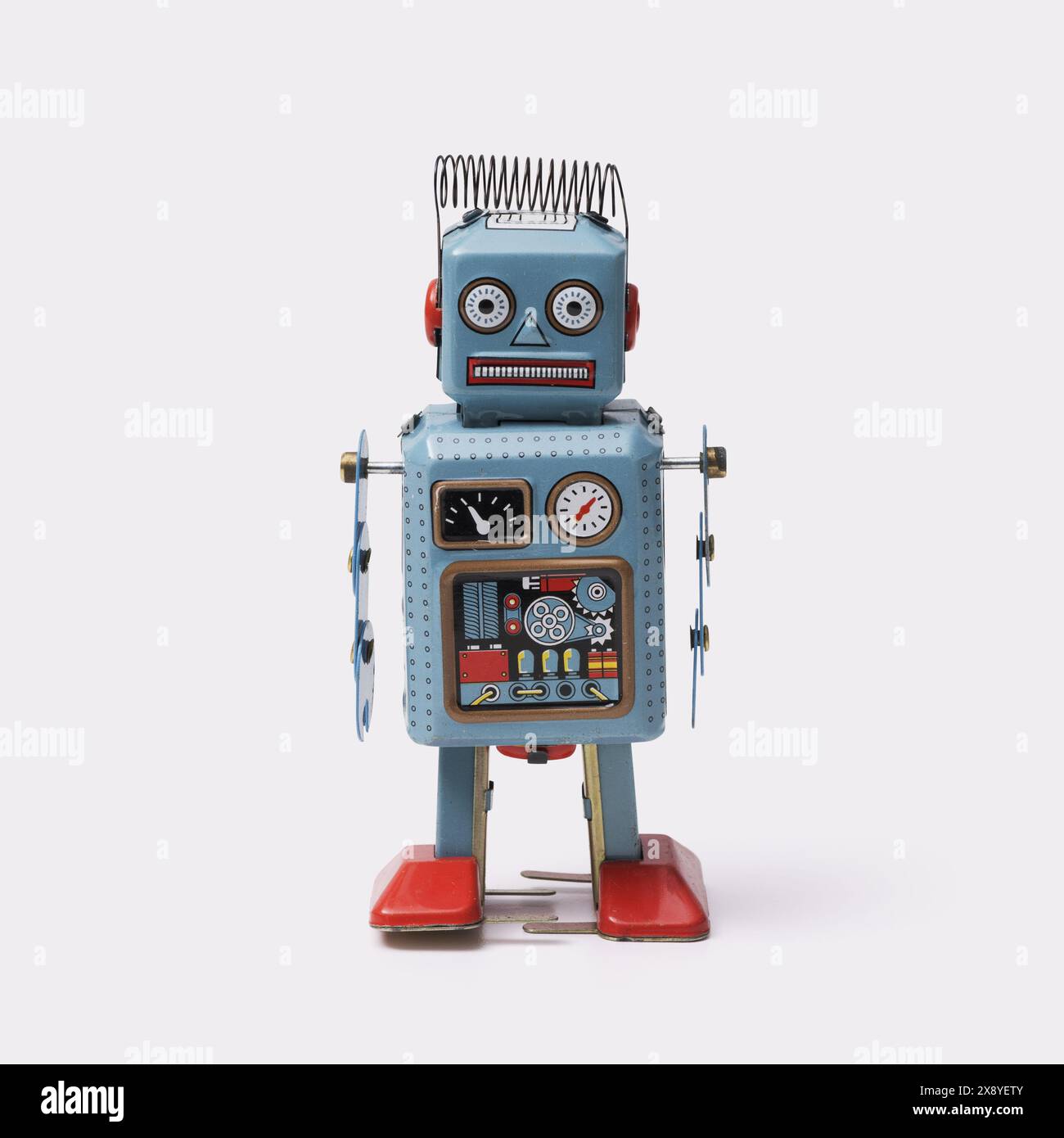 Funny vintage tin toy robot on white background, wind-up toys and ...